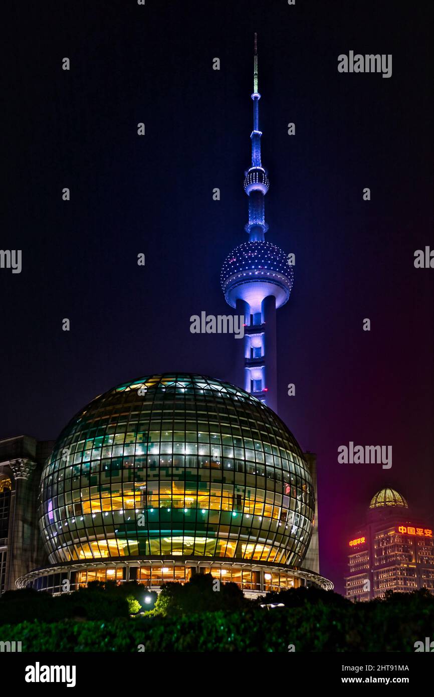 Vertical shot of the beautiful TV tower in Pudong, China at night with ...