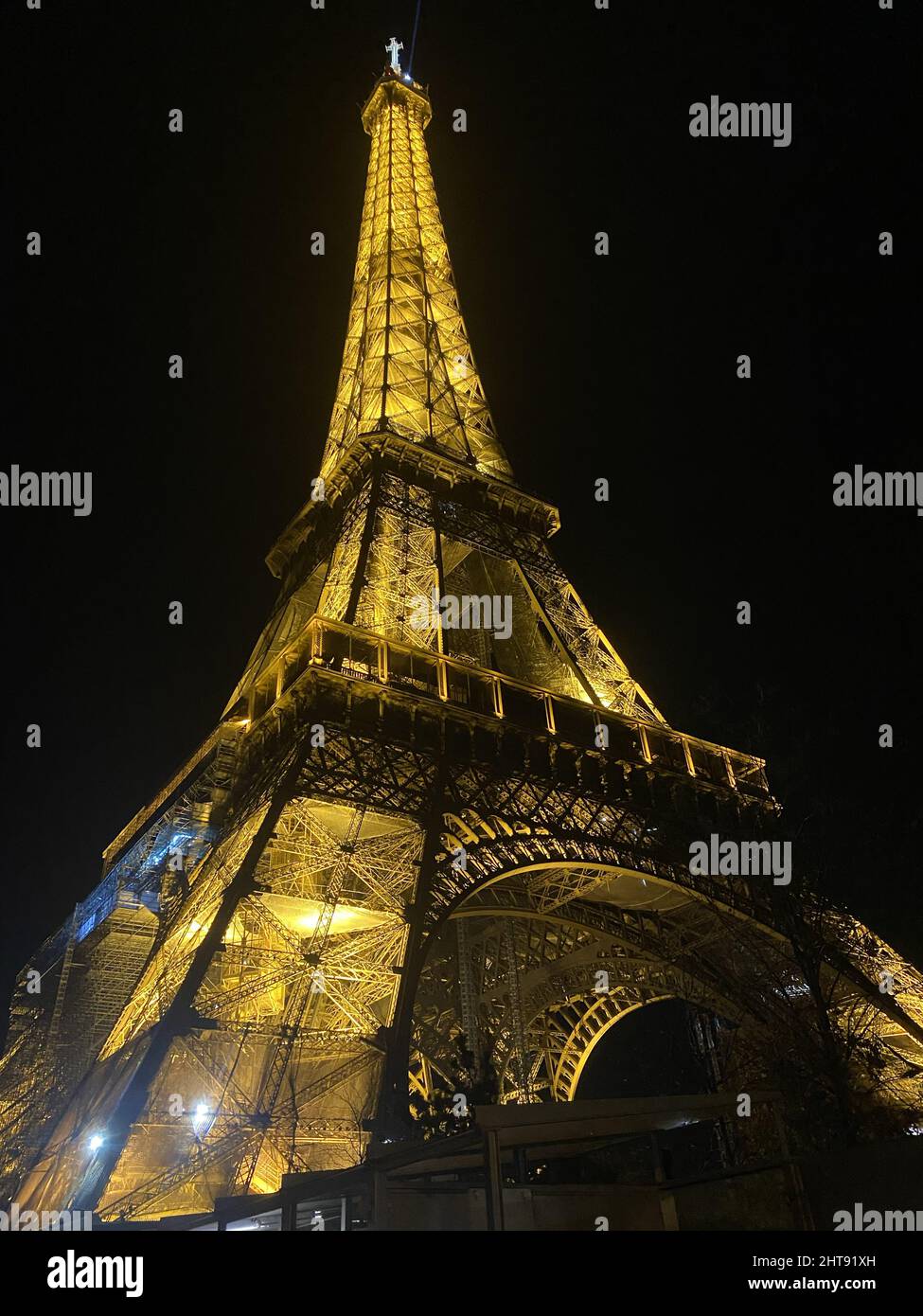 Eiffel Tower, a wrought-iron lattice tower against a dark night in ...