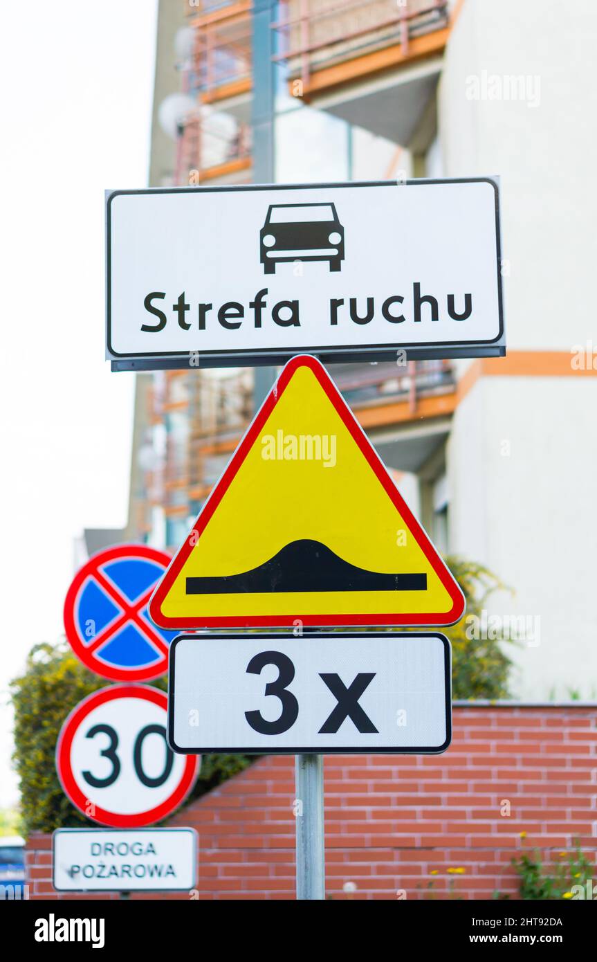 Vertical shot of the street signs with the writing Traffic zone in ...