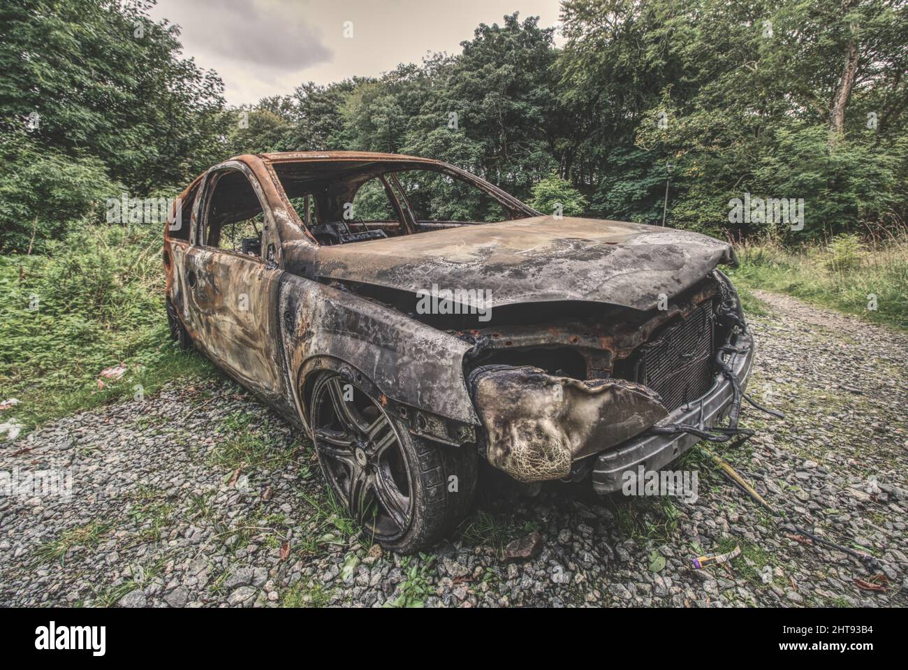HDR bruned car lost place abandon Stock Photo - Alamy