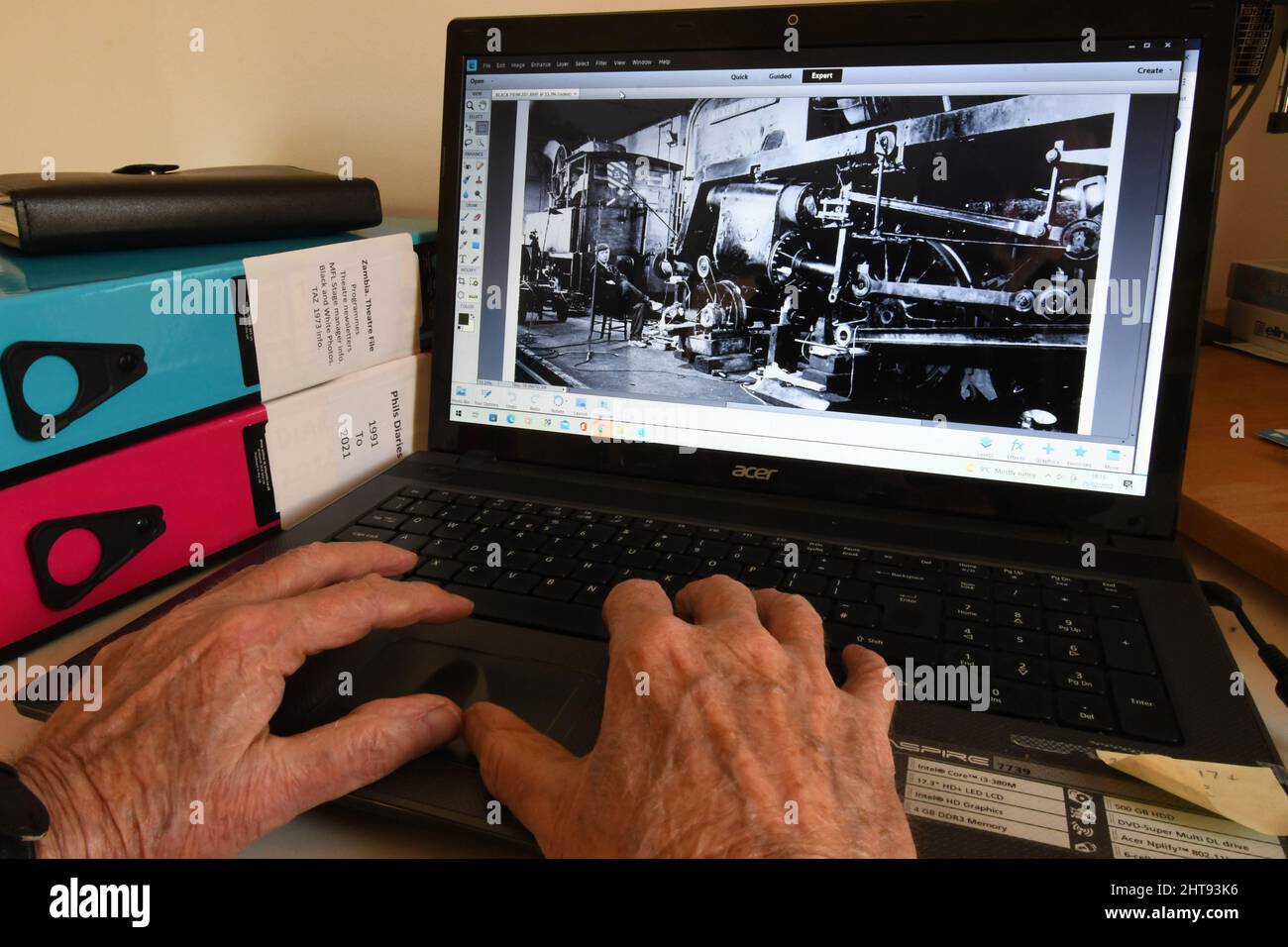 Old Hands at a computer keyboard finding pictures to trigger pleasant ...