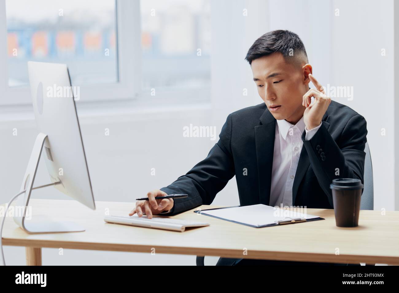 man sitting at a desk in front of a computer emotions technologies ...