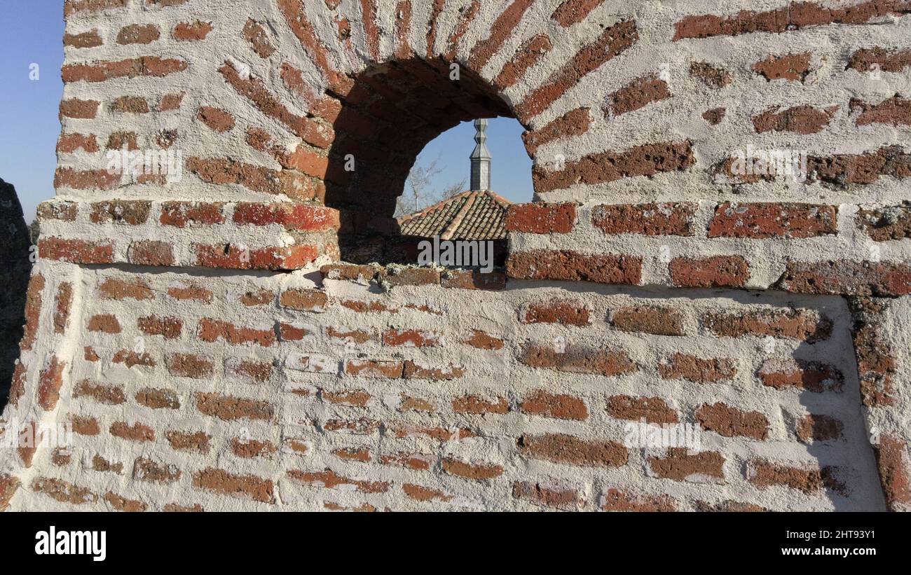Ancient Roman Arch in a mixed stone and brick wall Stock Photo - Alamy