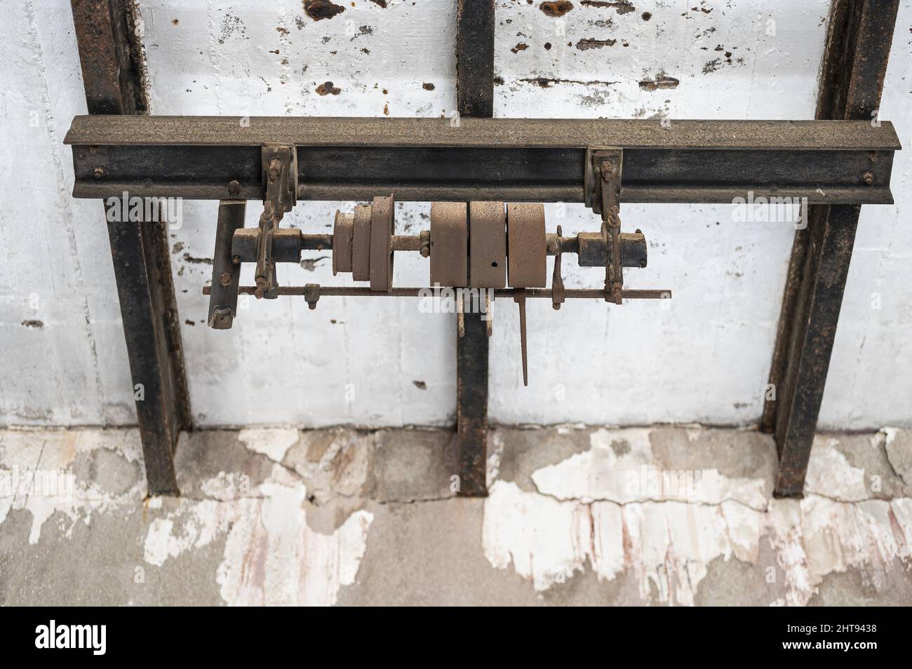 Remains of some old rusty pulleys from a factory Stock Photo - Alamy