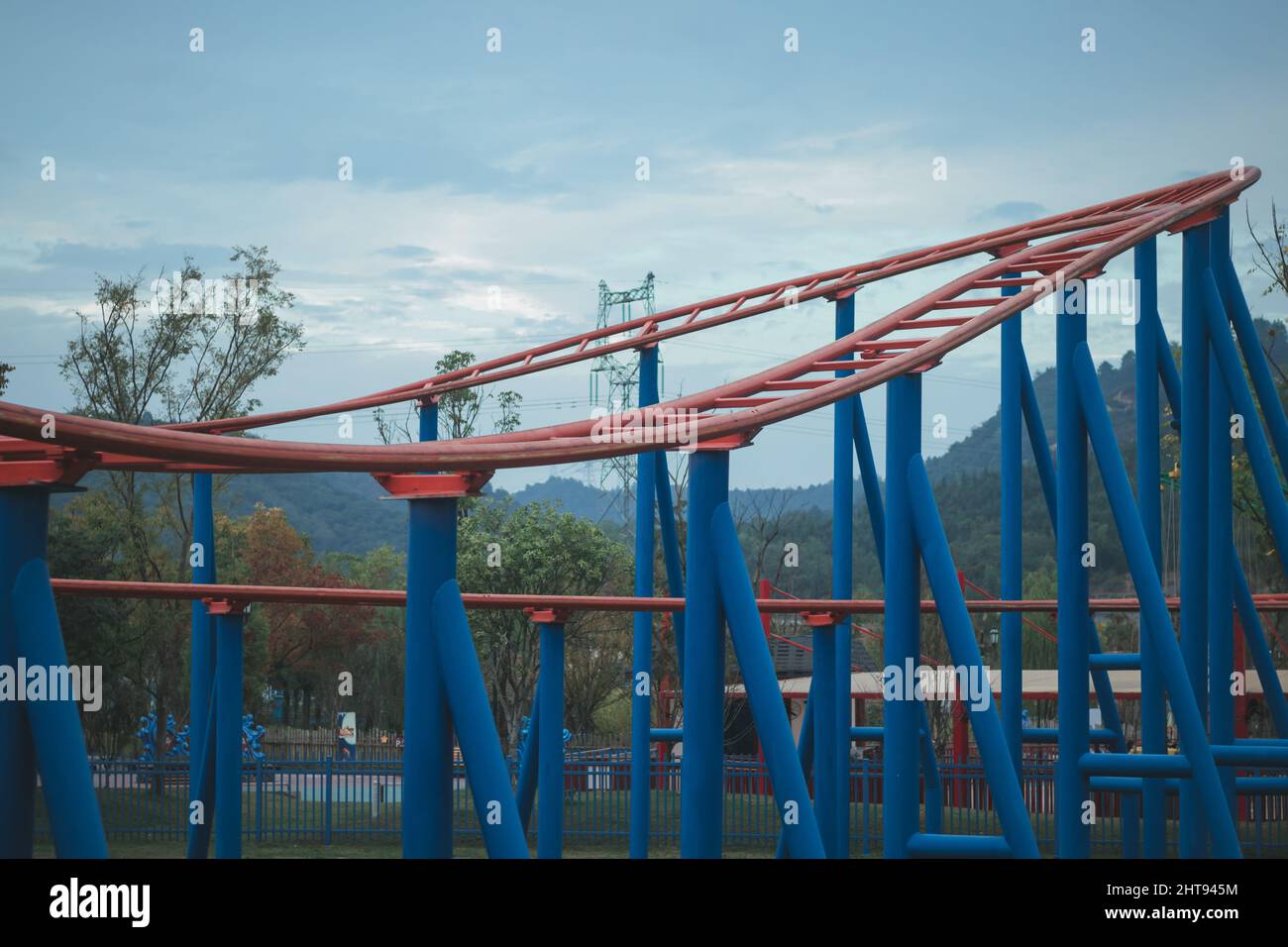 Colorful rollercoaster rails in the amusement park Stock Photo - Alamy