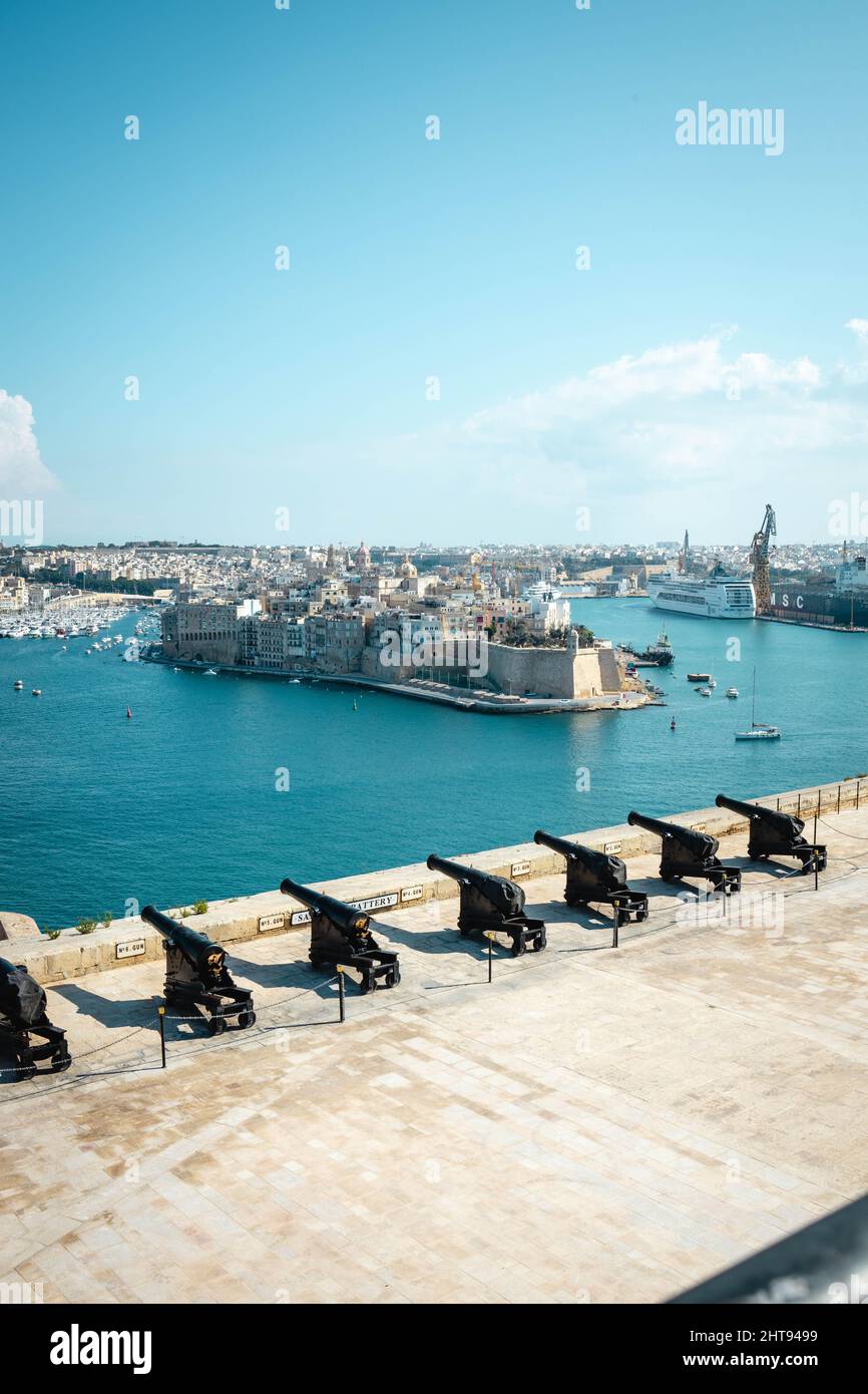 Vertical shot of a white boat in the sea in Valeta, Malta Stock Photo ...