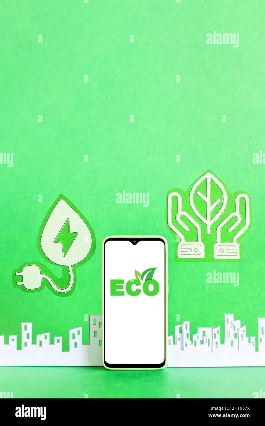 Smart phone with an eco application on a green background Stock Photo ...