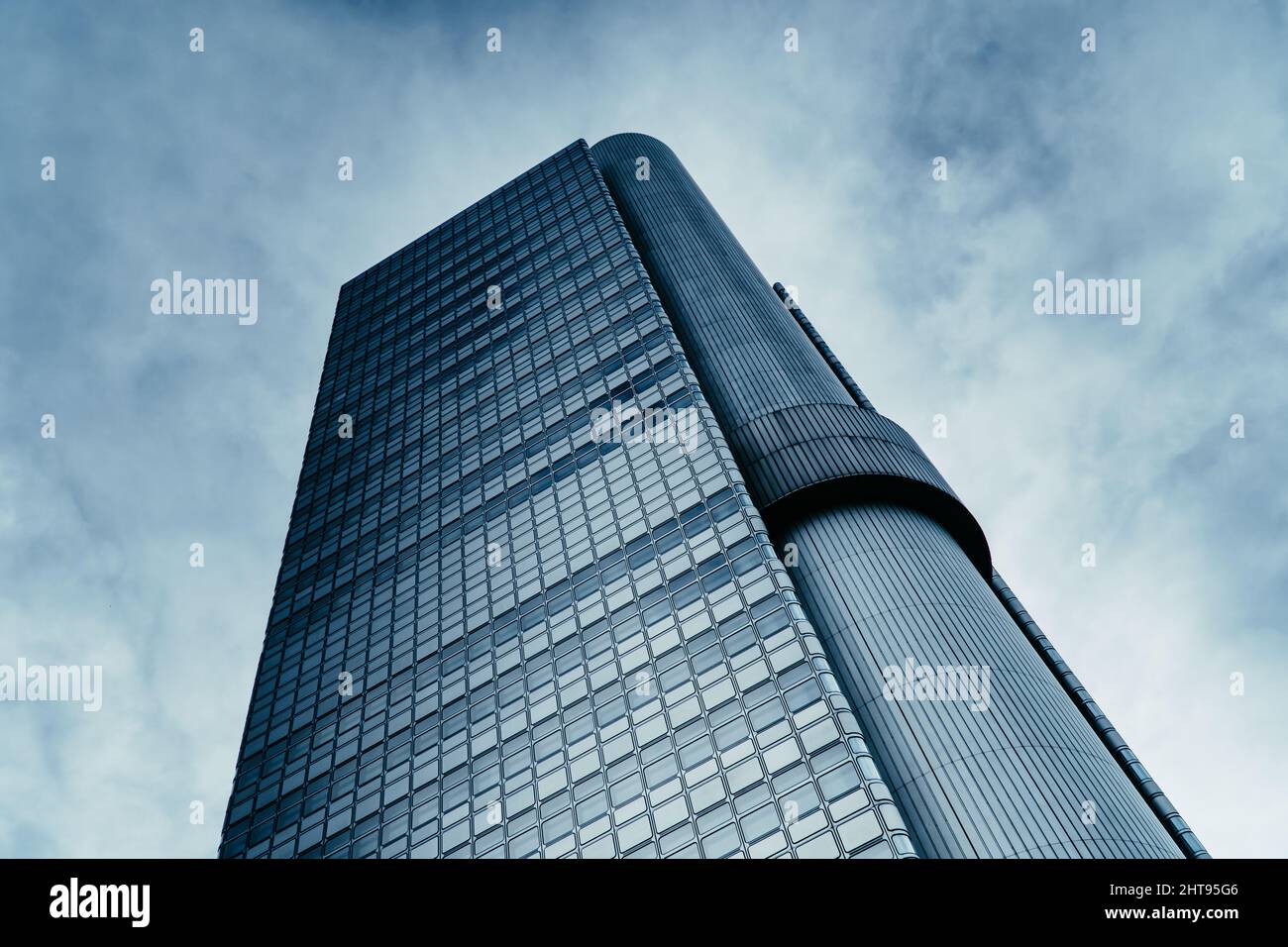 Low angle shot of a modern business building with big windows under a ...