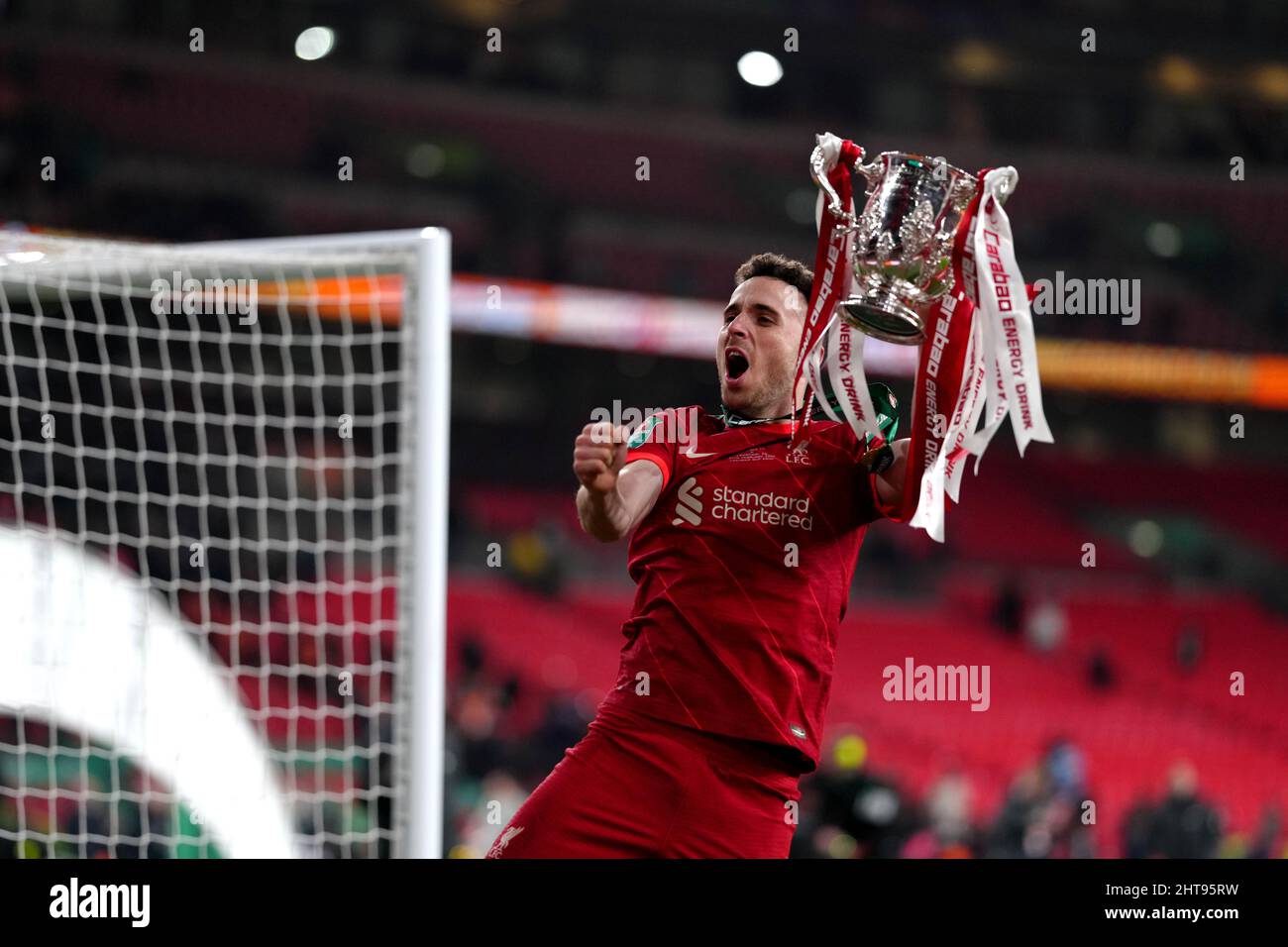 Liverpool's Diogo Jota celebrates with the trophy after the Carabao Cup ...