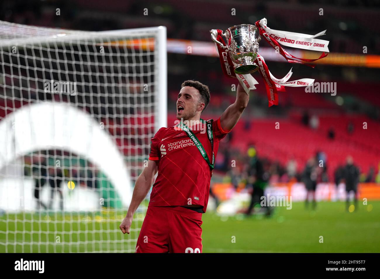 Liverpool's Diogo Jota celebrates with the trophy after the Carabao Cup ...