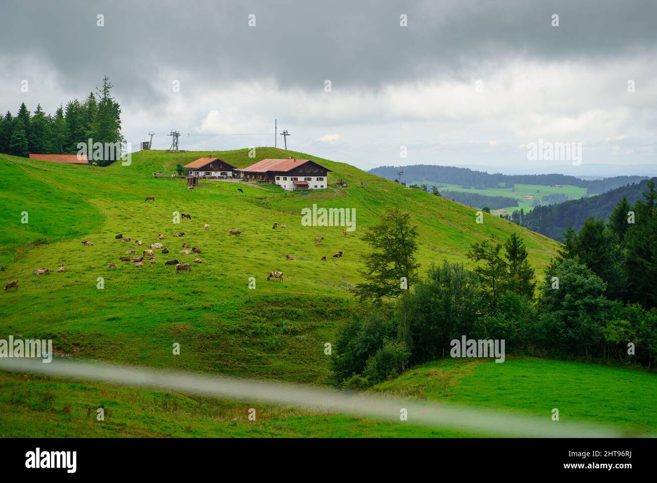 Scenic view of cozy village houses on the green hill, Hundle, Bavarian ...