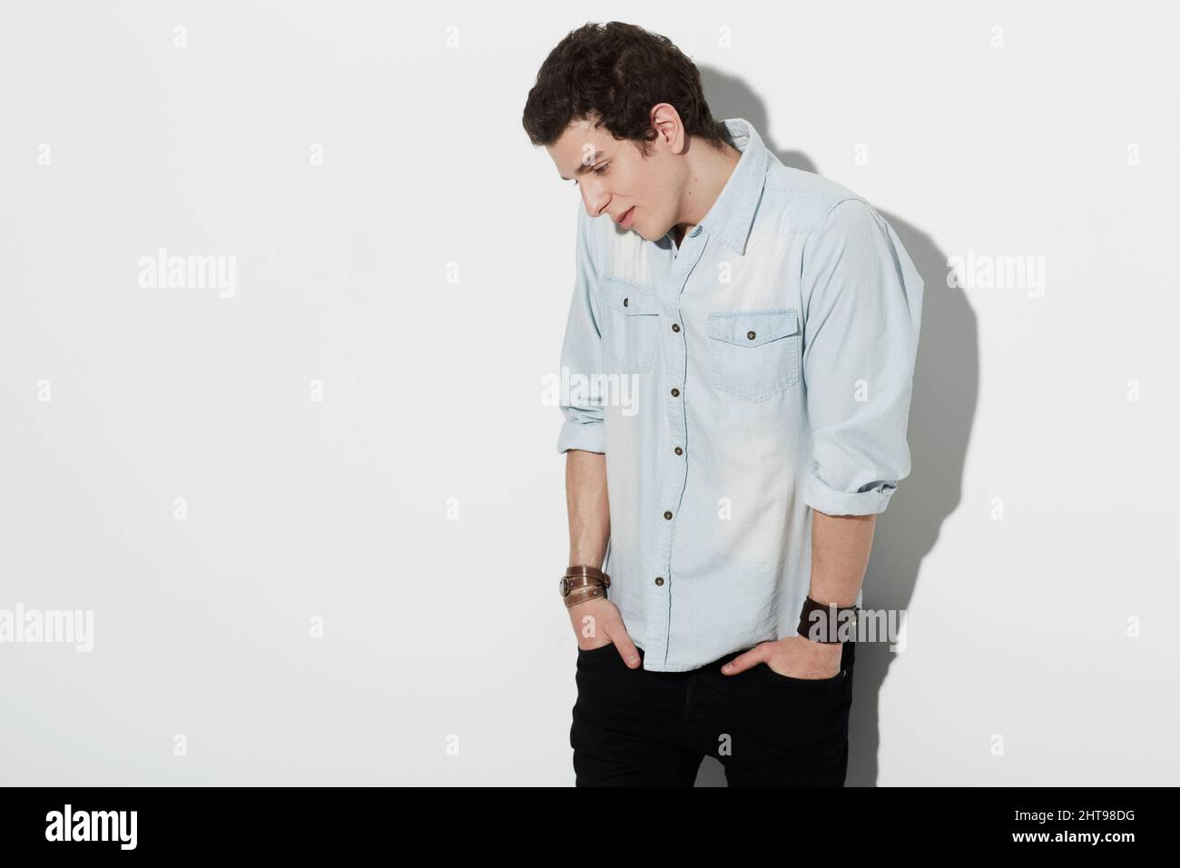 Young man standing awkwardly in hi-res stock photography and images - Alamy