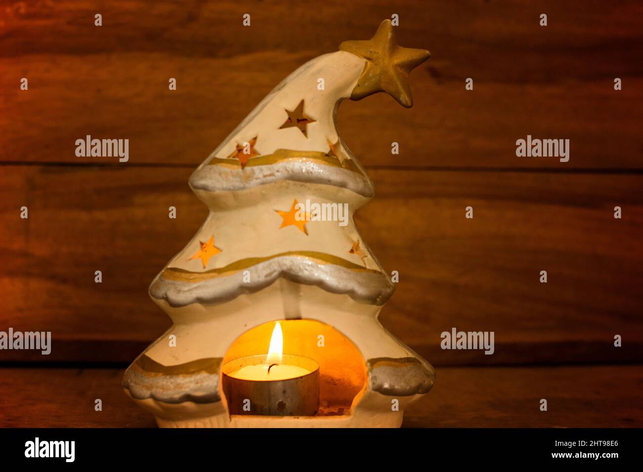 Candle in the shape of a Christmas tree with a burning candle Stock ...