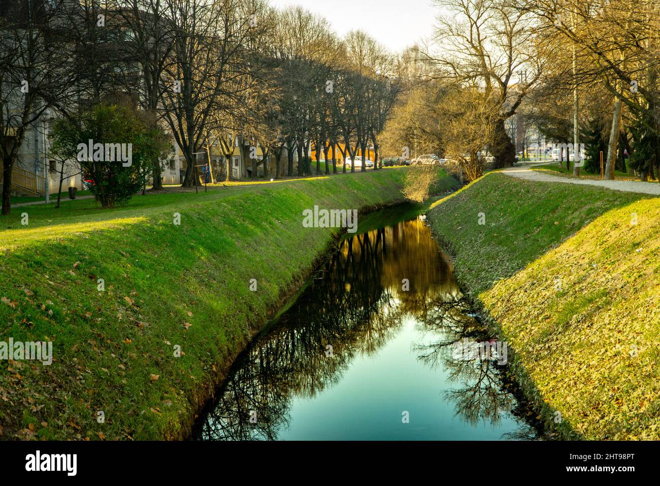 Water canal in the park Stock Photo - Alamy