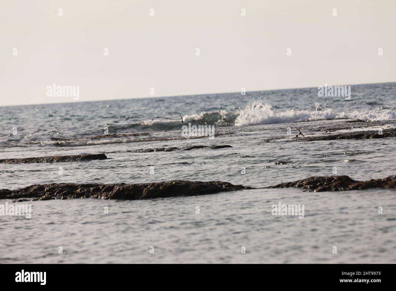 low waves on the shore of a beach High quality Stock Photo - Alamy