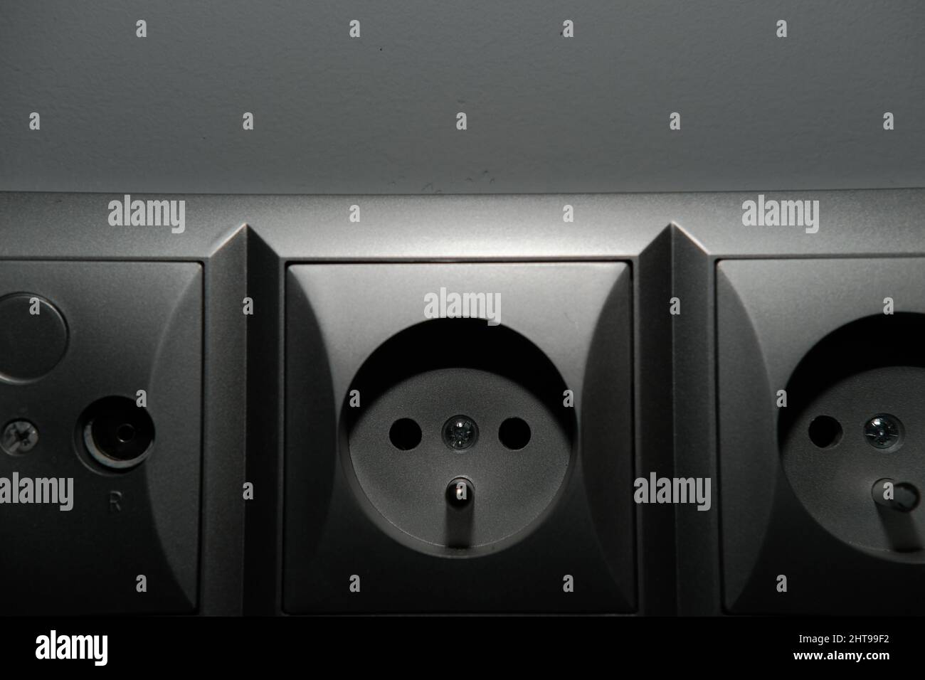 Closeup front view of black shiny power sockets Stock Photo - Alamy