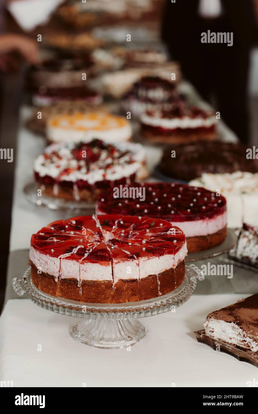 Buffet table of delicious cakes Stock Photo - Alamy