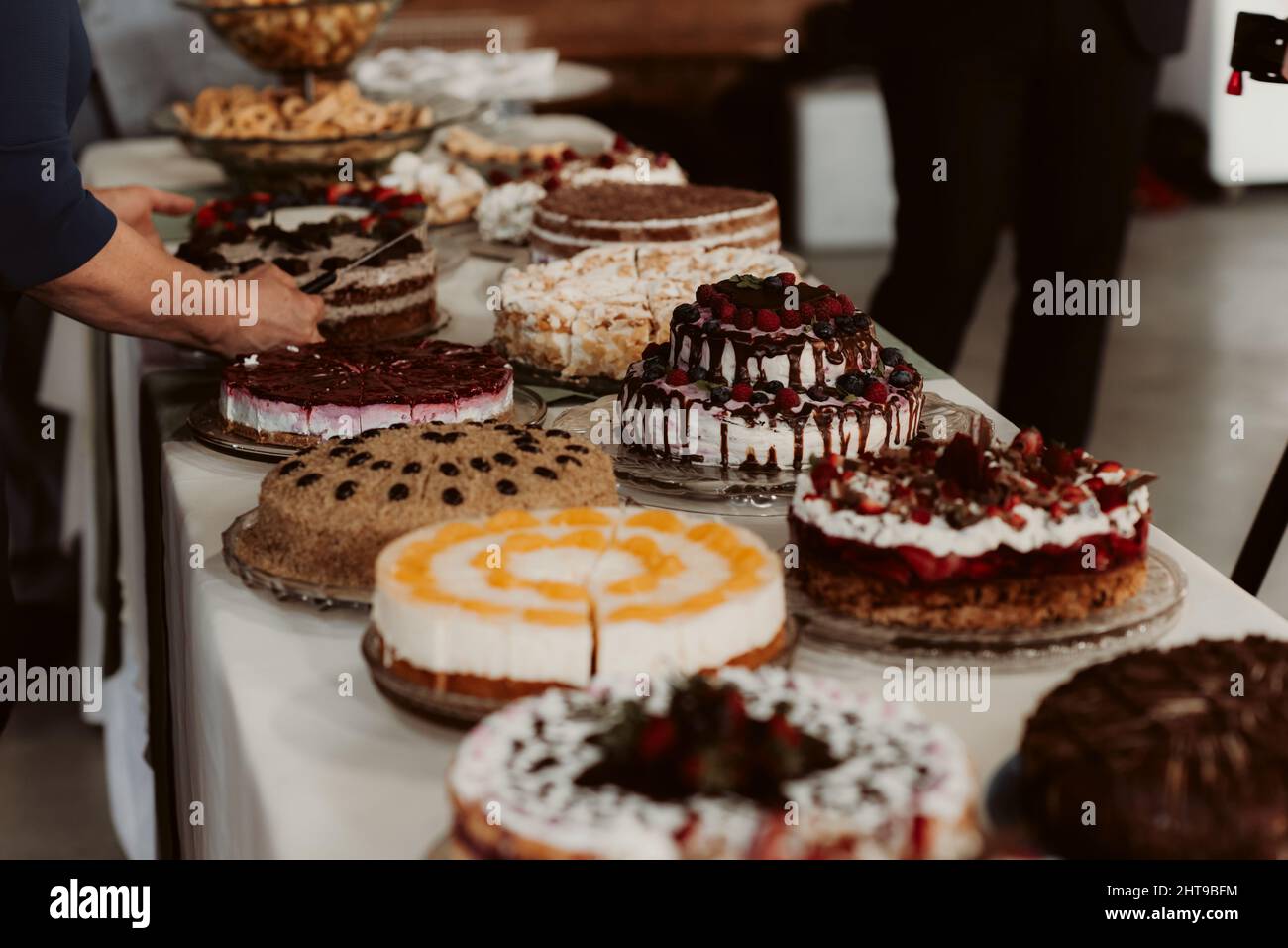 Buffet table of delicious cakes Stock Photo - Alamy