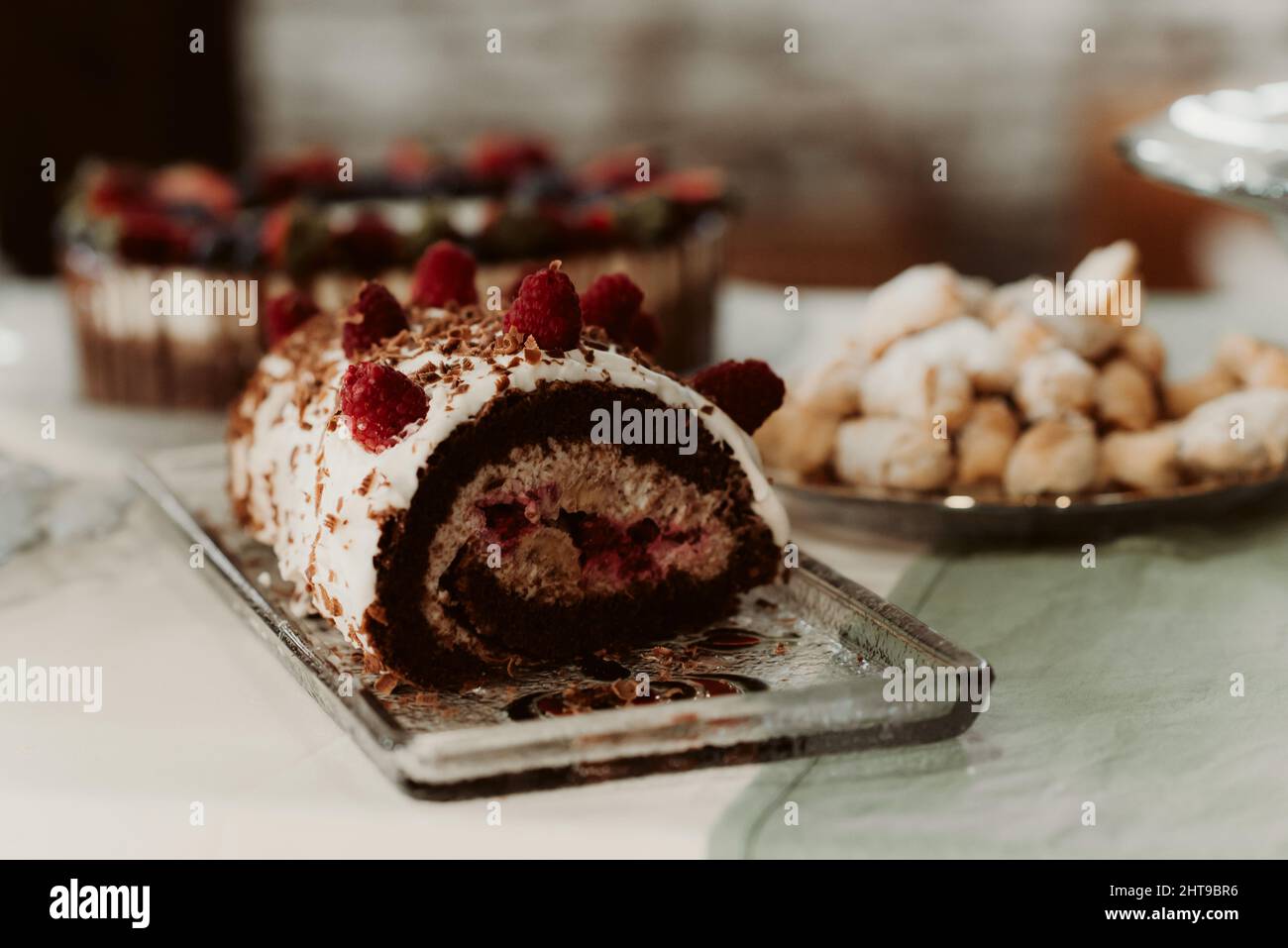 Closeup of a yummy cake roll with strawberries on a table Stock Photo ...