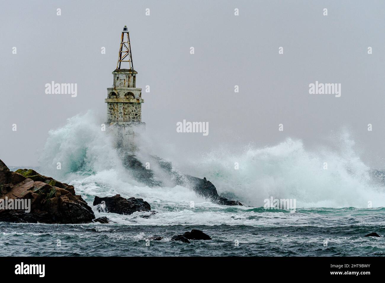 Closeup of a lighthouse in the ocean Stock Photo - Alamy