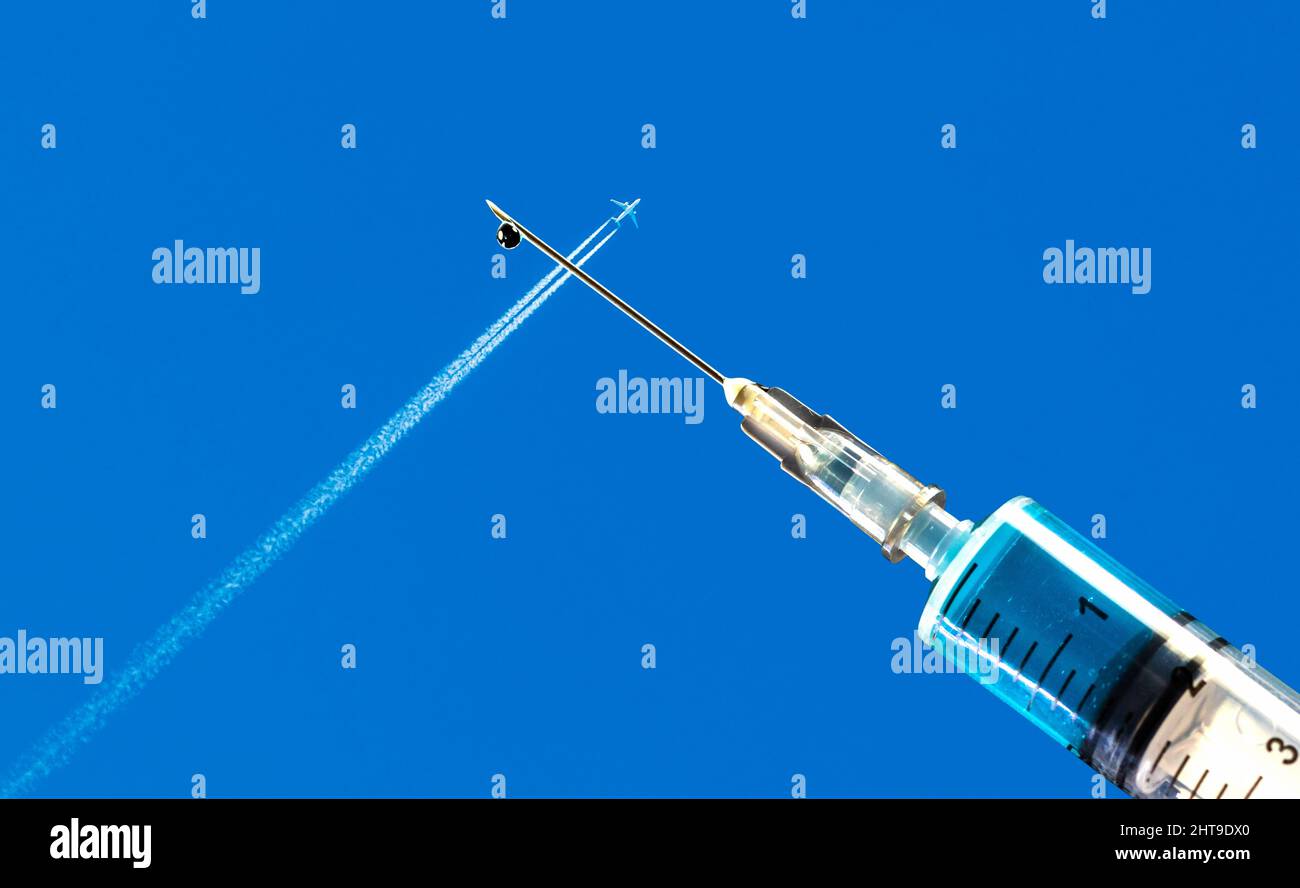 Blue sky with airplane and syringe of vaccine - Travel around the world ...