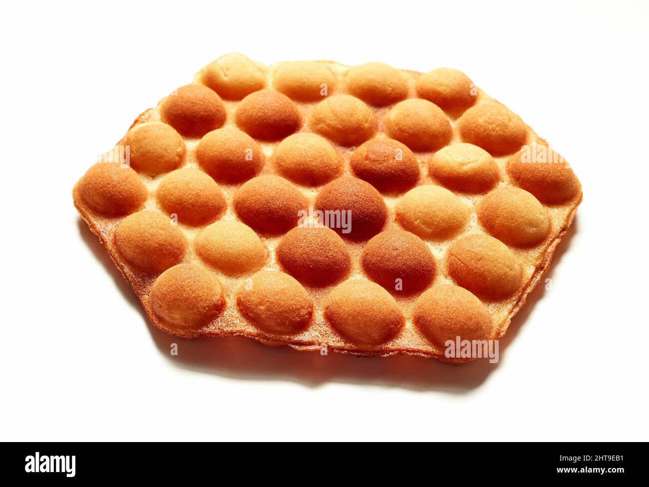 Appetizing traditional bubble wafer placed on white background Stock ...