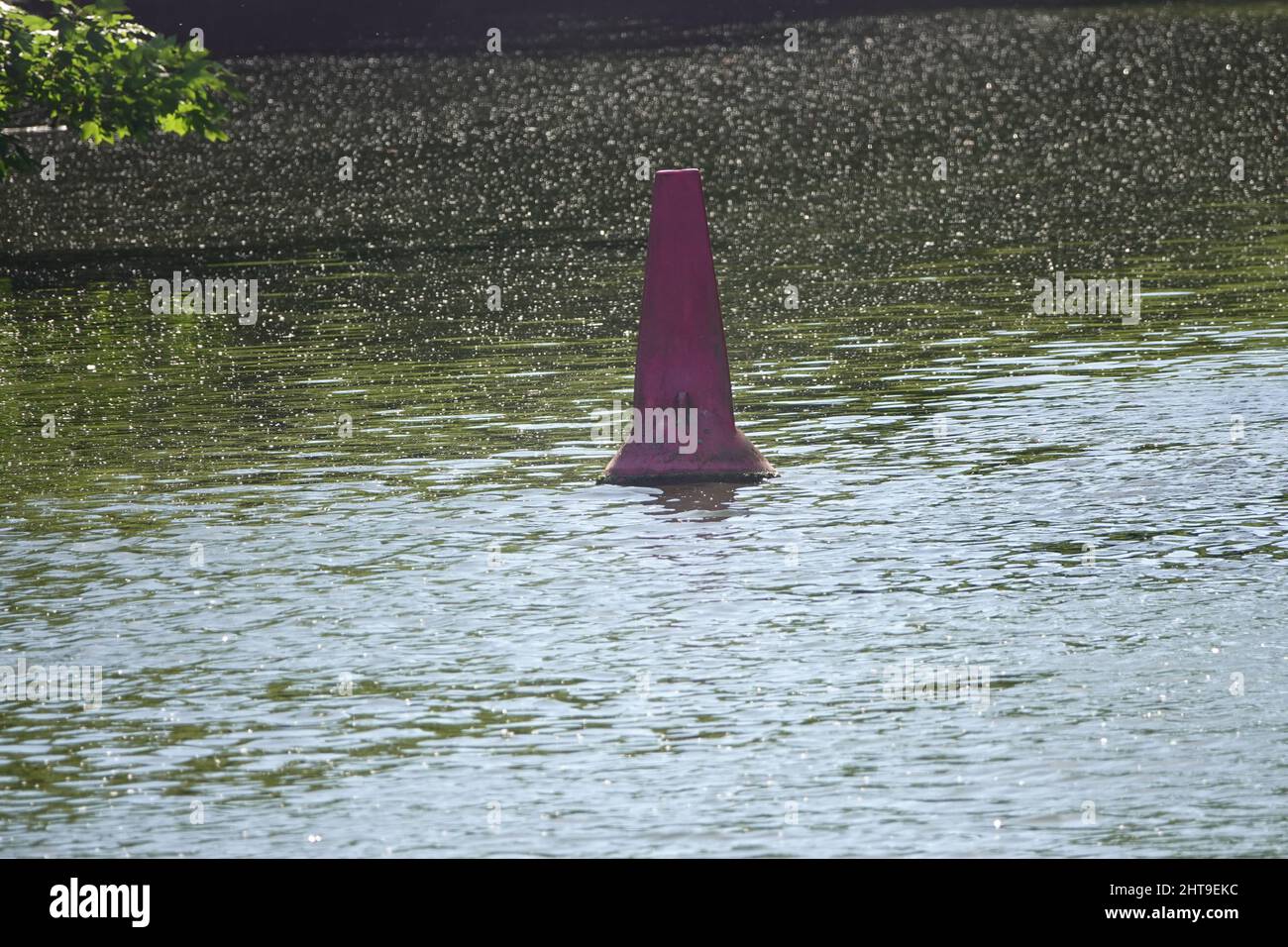 Purple object erected in a body of water on a rainy day Stock Photo - Alamy