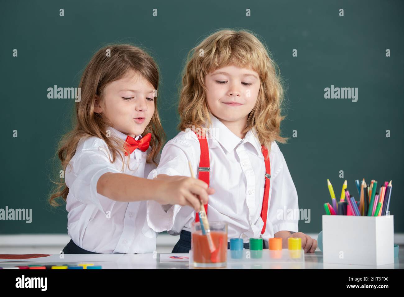 Early childhood education. Cute school friends kids drawing and ...