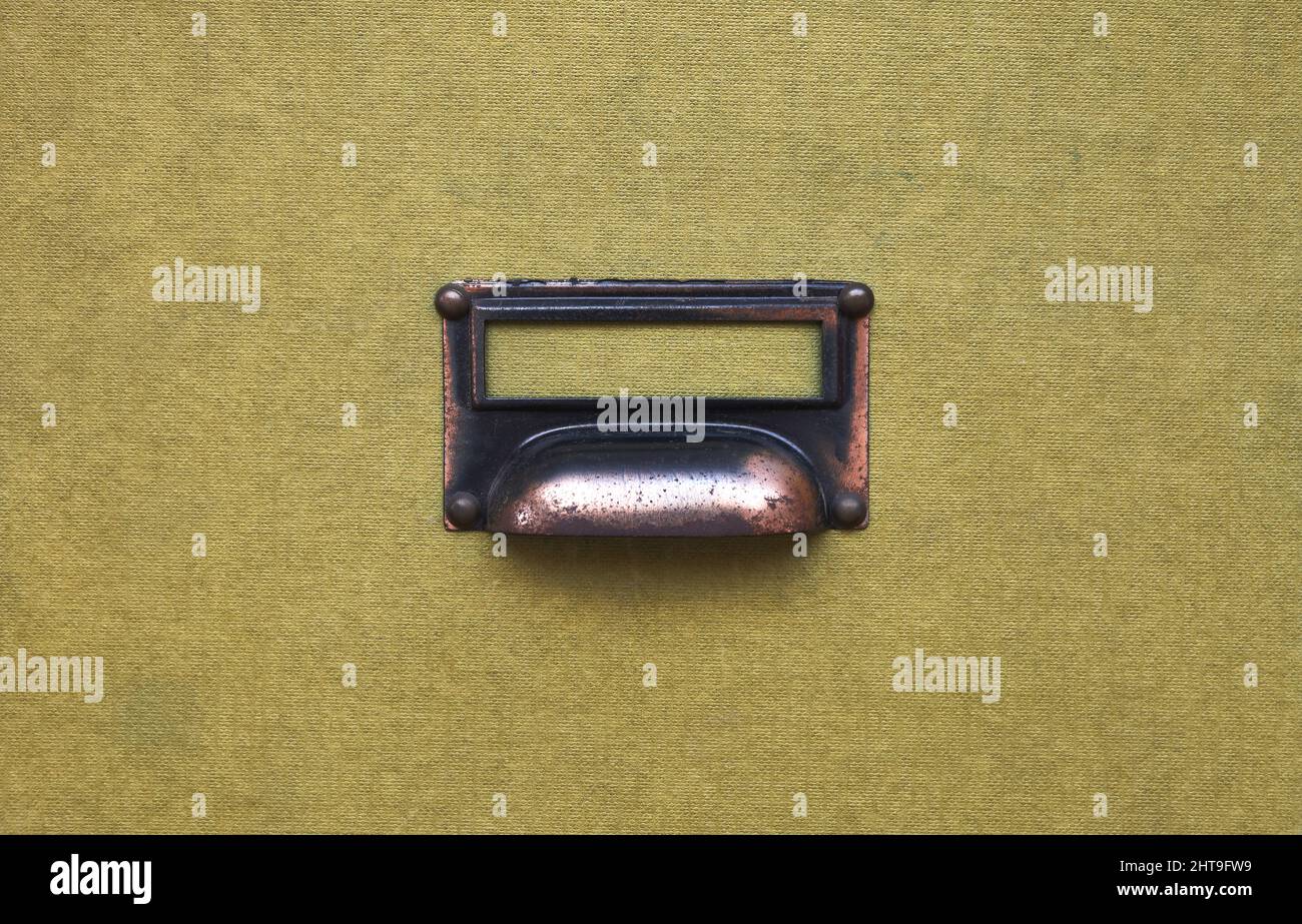 detail of a metal handle on a fabric texture of a filing cabinet Stock ...