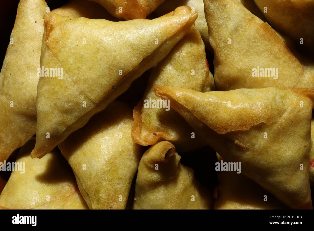 Closeup of a samosa pattern for food background Stock Photo - Alamy