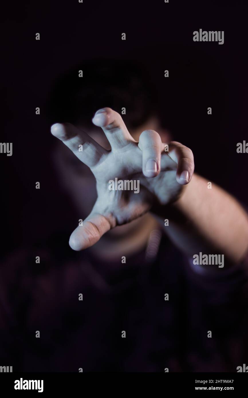 Vertical shot of a man's hand reaching forward Stock Photo - Alamy
