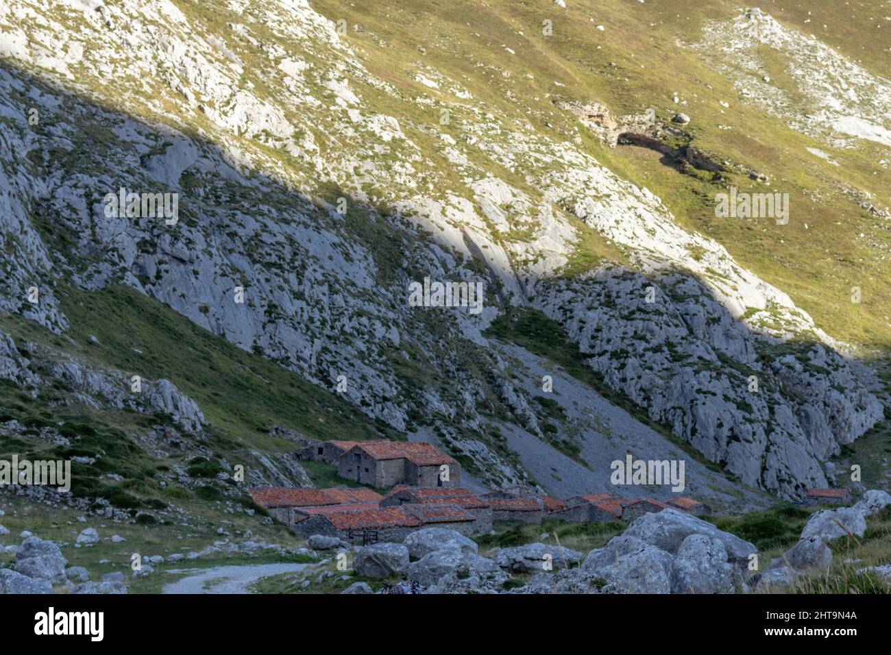 Old livestock barns below Escamilla peak in Asturias, Spain Stock Photo ...