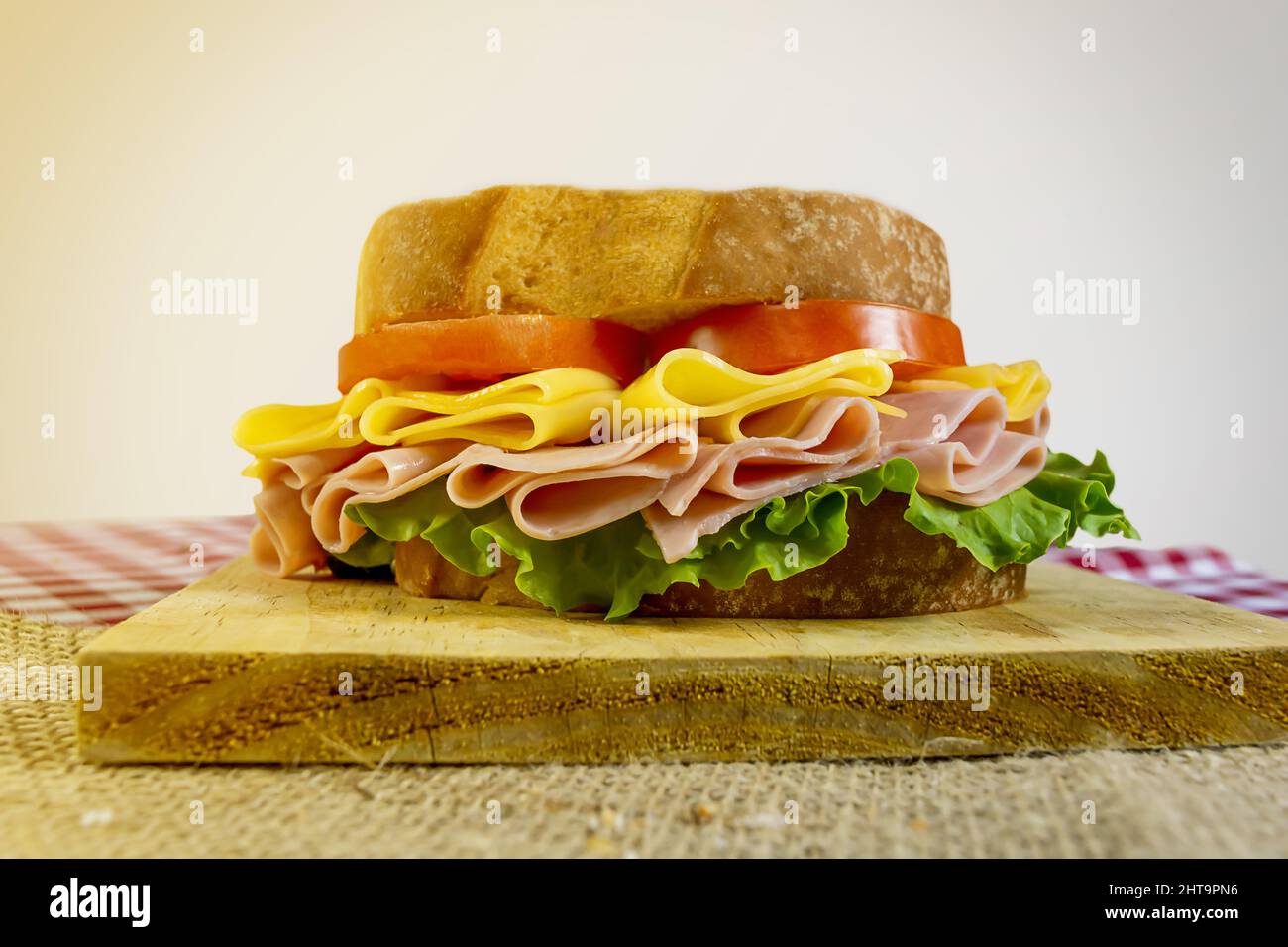 Closeup of a ham sandwich on a chopping board Stock Photo - Alamy