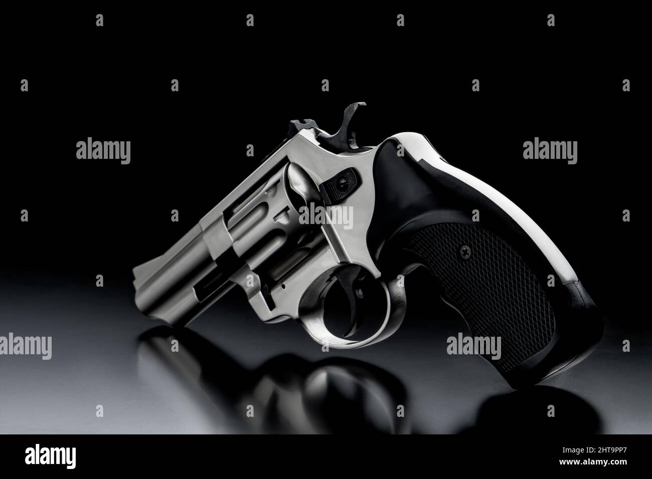 Silver gun revolver on a dark background. Pistol. Weapons for self ...