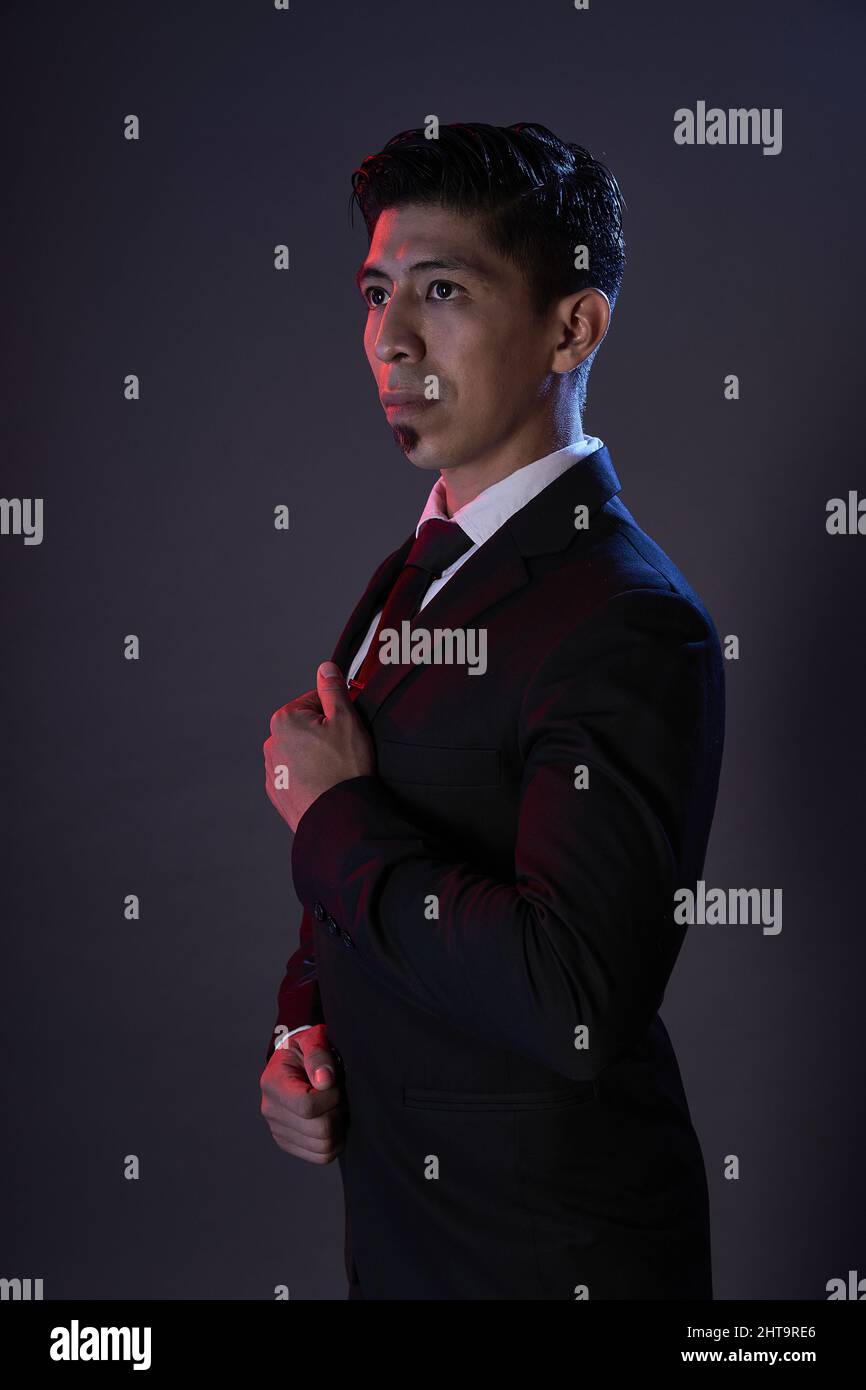 Asian male tango ballroom dancer in suit Stock Photo - Alamy