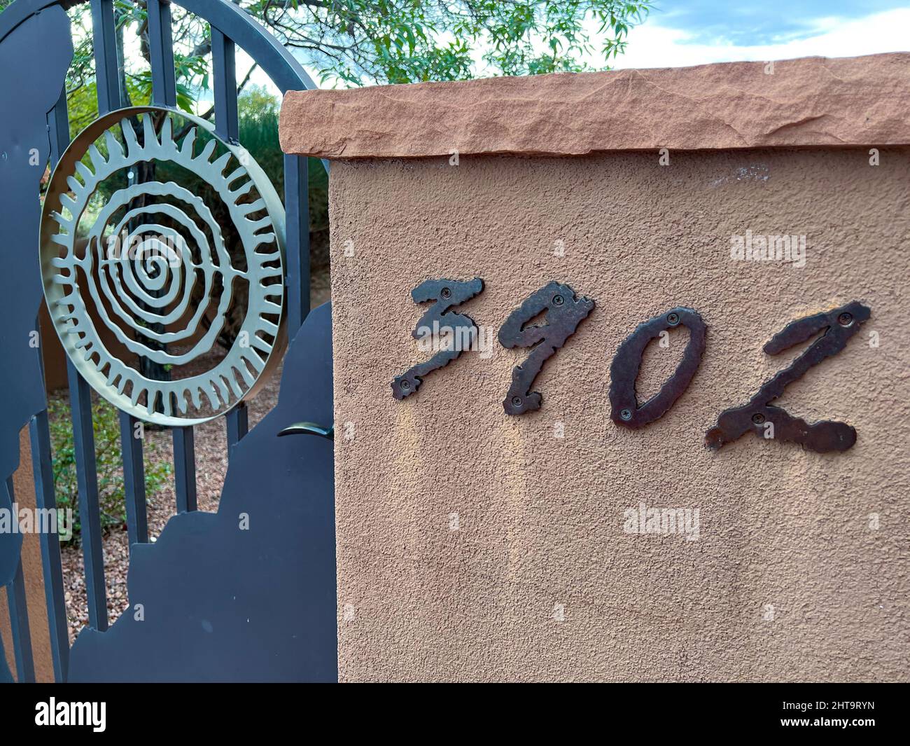 Closeup of a spiral gate design and numbers in a park Stock Photo - Alamy