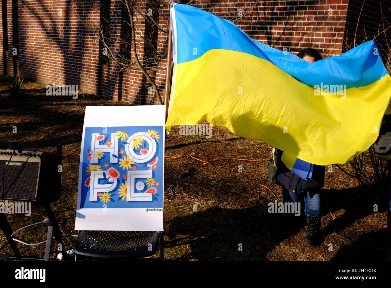 A Ukrainian Flag waving with a sign for hope at a rally in Metuchen, NJ ...