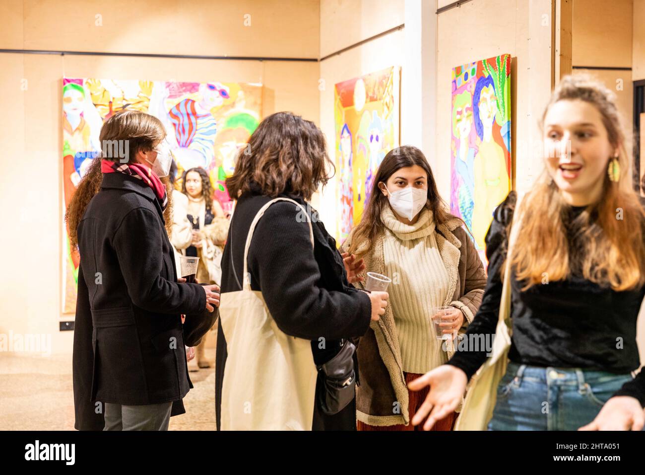 Audience during an art exhibition opening in the vibrant Stock Photo ...
