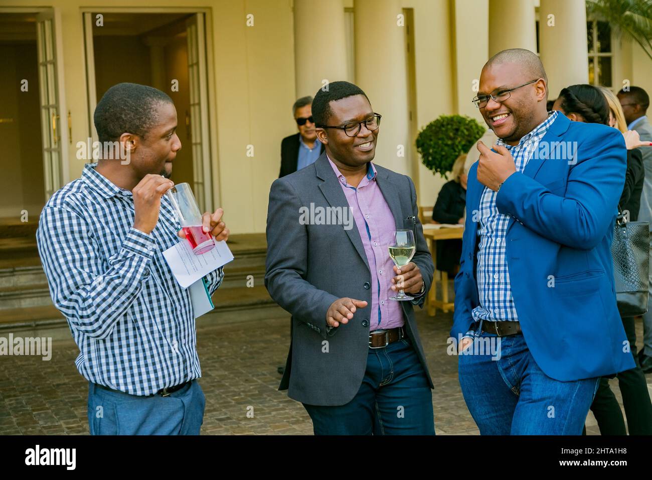 Number of VIP guests mingling at an outdoor social event in ...