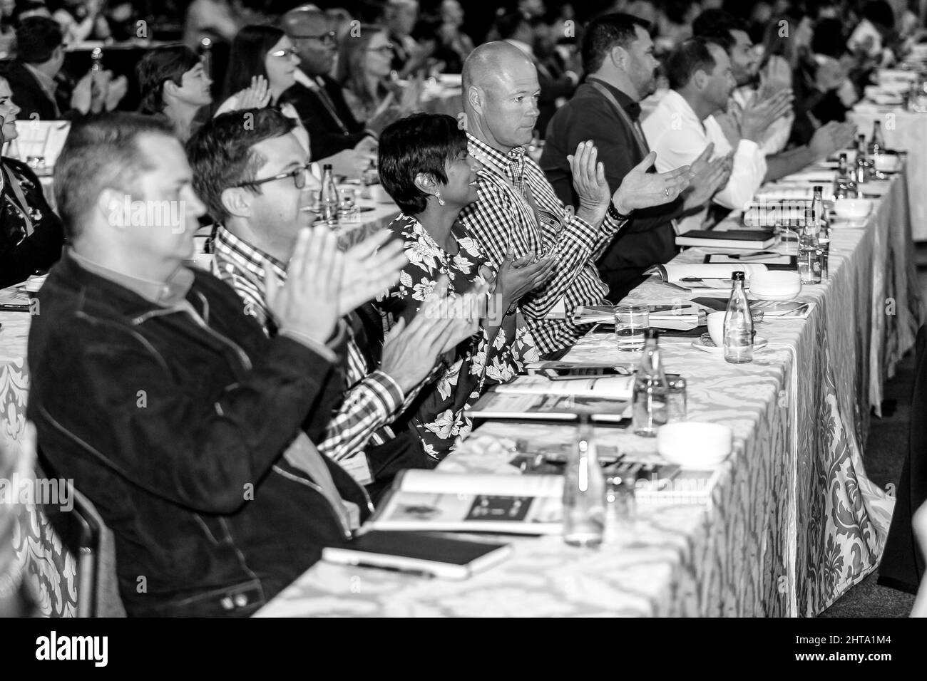 Delegates attending sales convention at the large conference center in ...