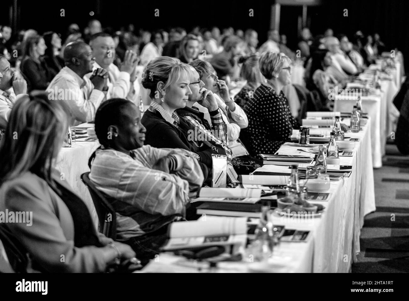 Delegates attending sales convention at the large conference center in ...