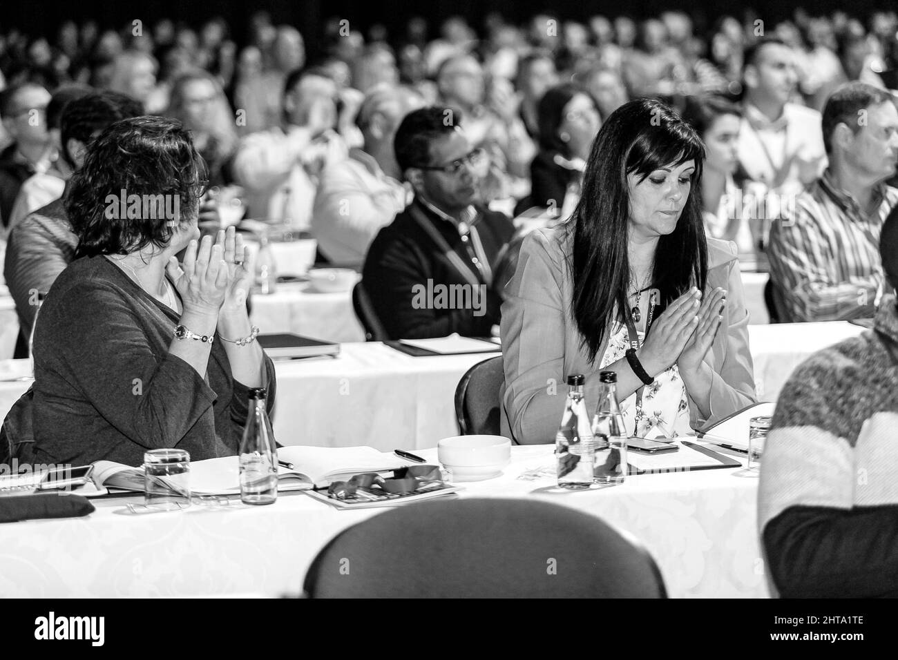Delegates attending sales convention at the large conference center in ...