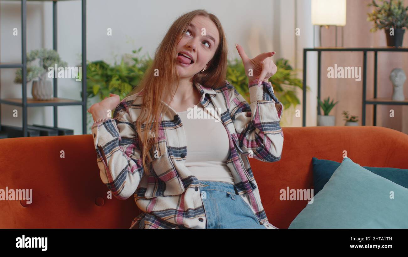 Funny amusing young funny woman making playful silly facial expressions ...