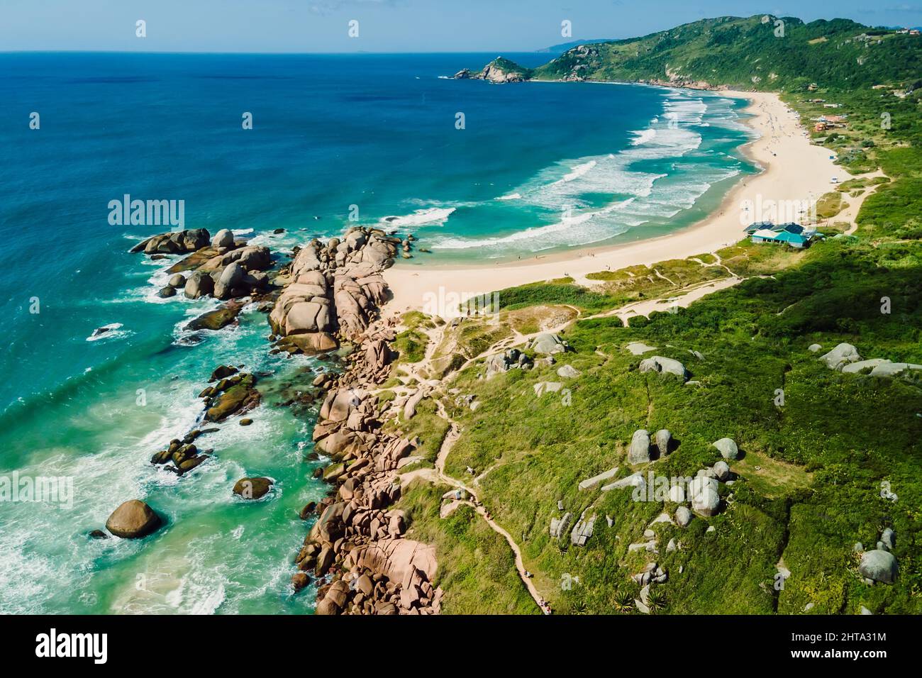 Coastline on Mole beach, rocks and ocean waves in Brazil. Aerial view ...