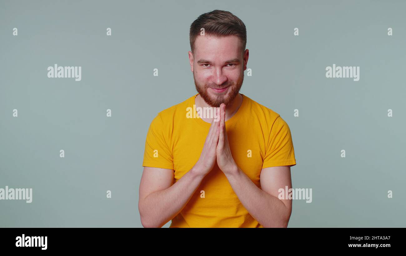 Sneaky cunning man with tricky face gesticulating and scheming evil ...