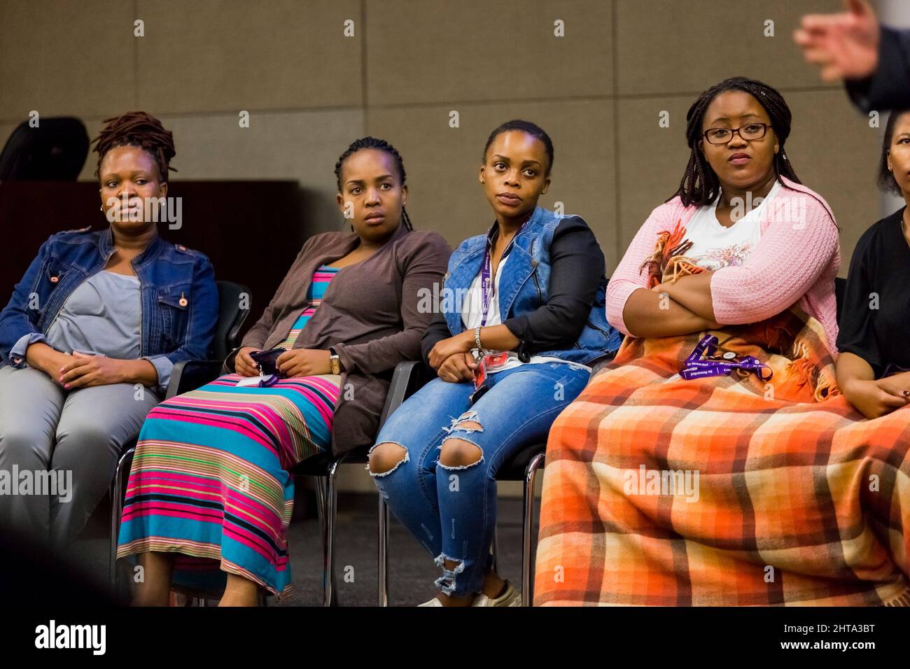 Closeup of the Diverse adult students attending a class on finance ...