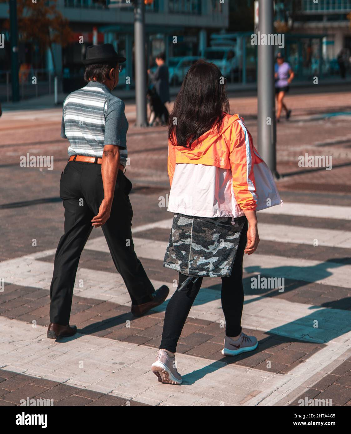 Vintage couple crossing road hi-res stock photography and images - Alamy
