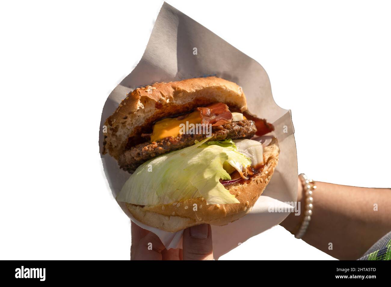 Cut out of a delicious burger held in female hands Stock Photo - Alamy