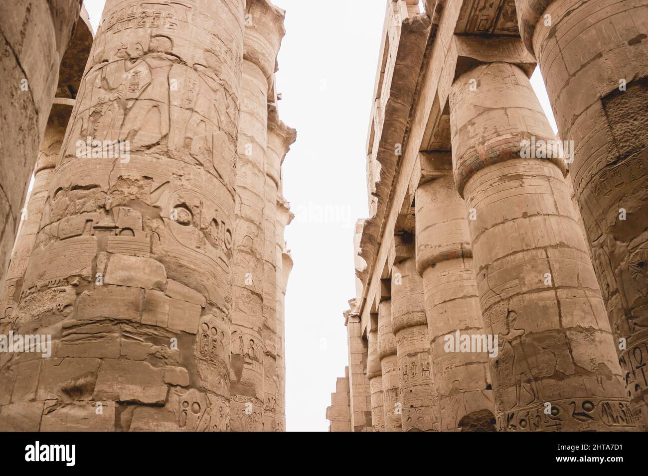 Row of columns with illustrations and hieroglyphs in Luxor, Egypt Stock ...