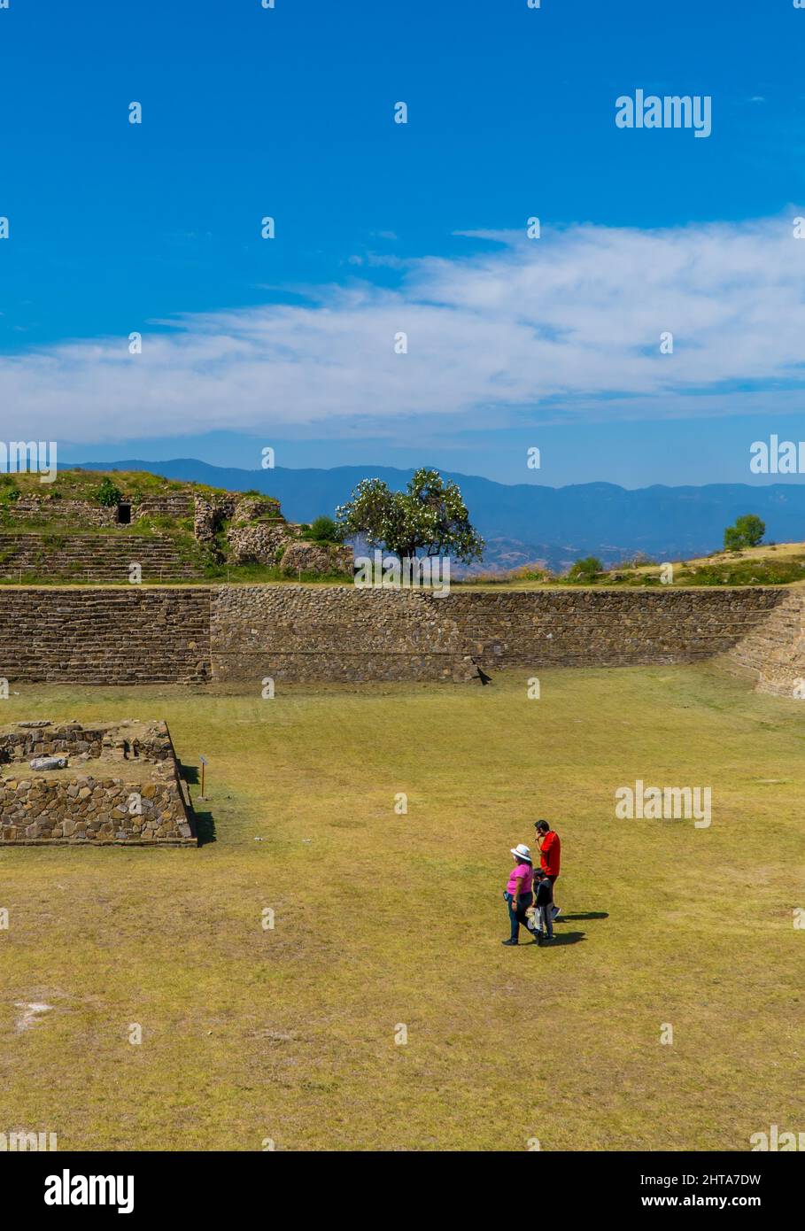 View of tourists and Zapotec temples inside Monte Alban Archaeological ...